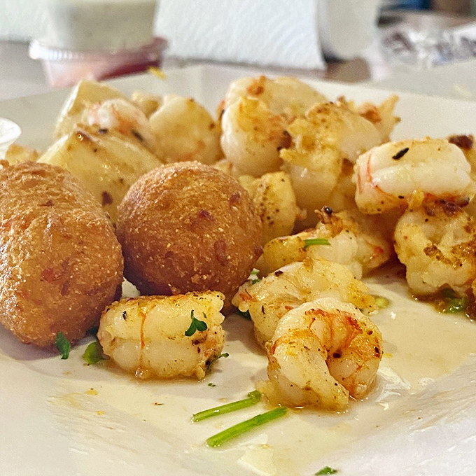 These golden hush puppies and succulent rock shrimp aren't just appetizers—they're the opening act to a seafood concert your stomach will applaud.