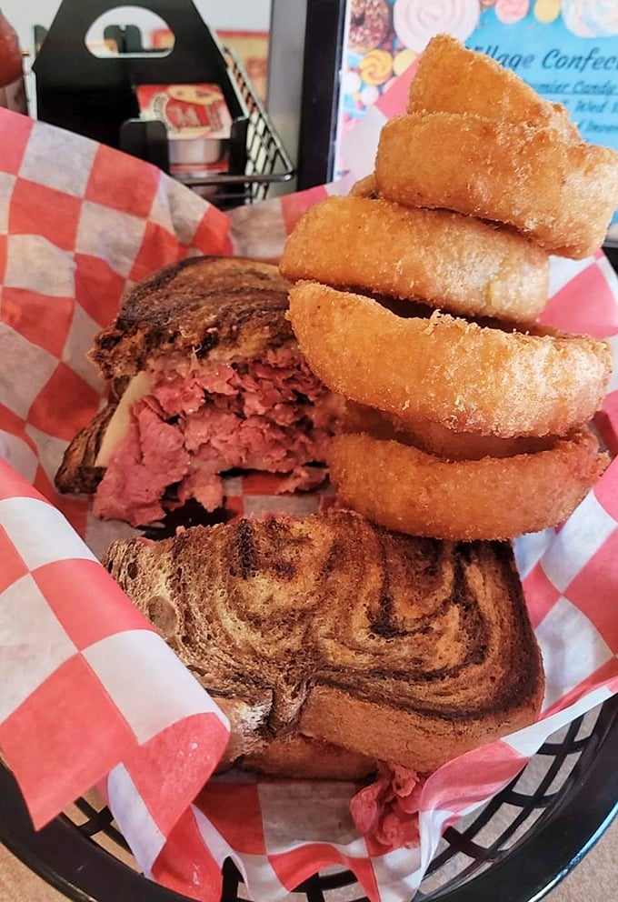 The mark of a truly great sandwich isn't just what's between the bread—it's those golden-brown onion rings standing at attention alongside it.