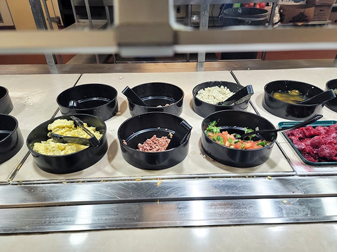 The salad bar's colorful array stands as a monument to good intentions, where health-conscious beginnings often surrender to bacon bit temptation.