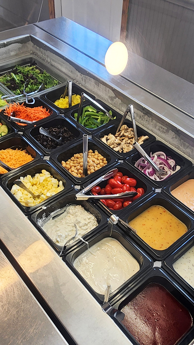 A salad bar that actually deserves your attention. This isn't sad airport food—it's a rainbow of fresh ingredients waiting to balance your indulgences.