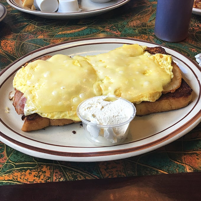 Eggs and ham on toast—a simple pleasure elevated to art form. That side of cream cheese says "we don't do basic here."