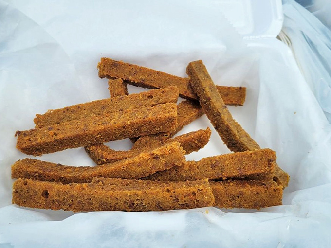 Golden-brown scrapple fries that somehow make Philadelphia's favorite mystery meat even more irresistible. Crispy outside, tender inside—the perfect sandwich companion.