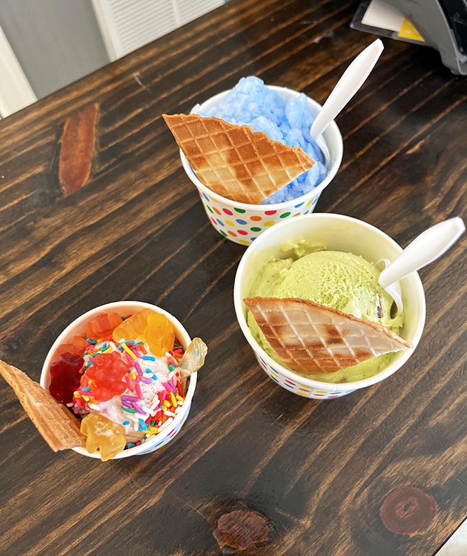 A triple threat of joy! Blue Italian ice, pistachio gelato, and a festive sundae—proof that decisions were meant to be ignored.