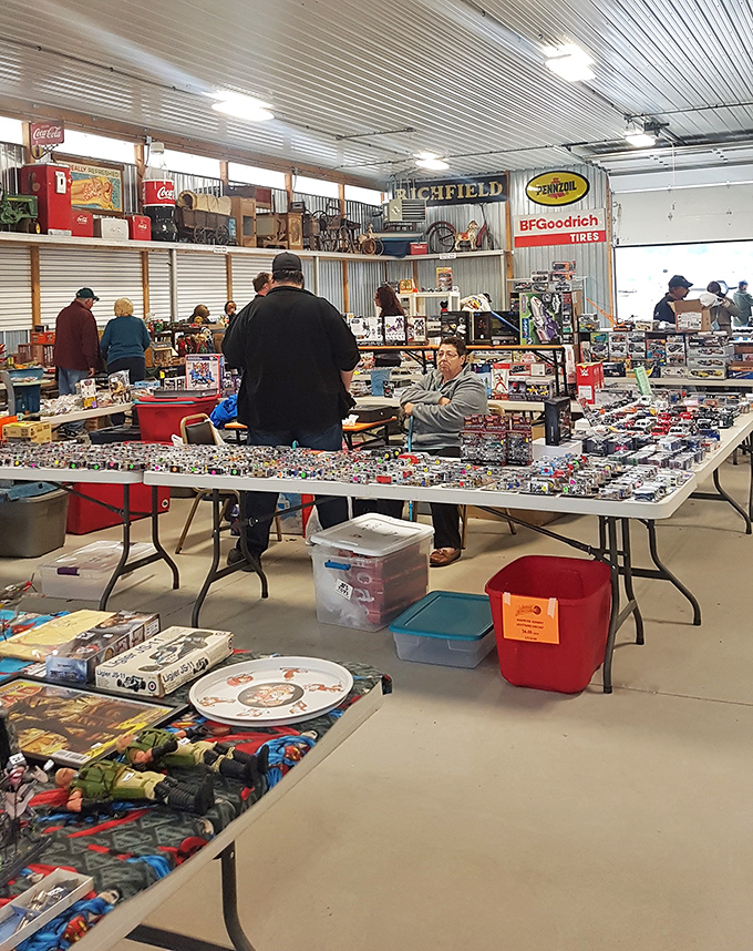 The indoor pavilion buzzes with serious collectors examining miniature cars with the focus of diamond appraisers at Tiffany's.