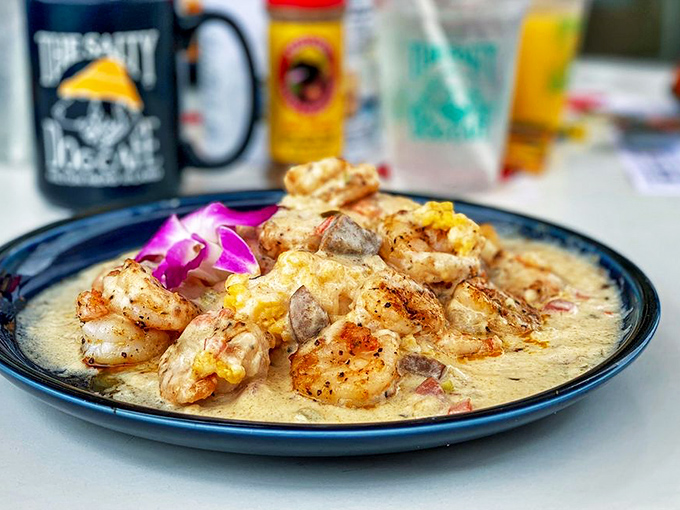 These shrimp aren't just swimming in grits—they're doing the backstroke in a pool of creamy, cheesy Southern comfort that demands a standing ovation.