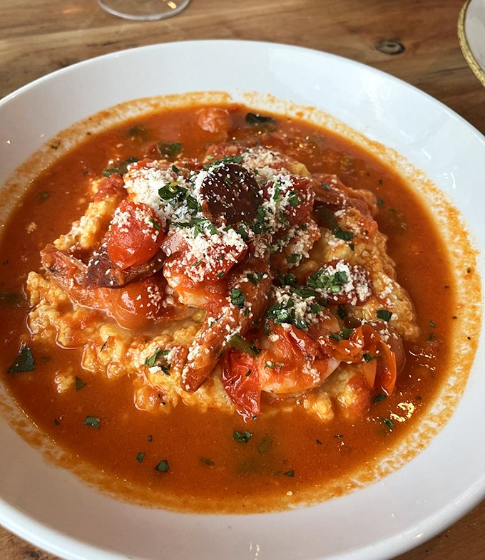 Shrimp and grits that would make a Southerner weep with joy—creamy, tomato-rich, and proof that comfort food can wear formal attire.