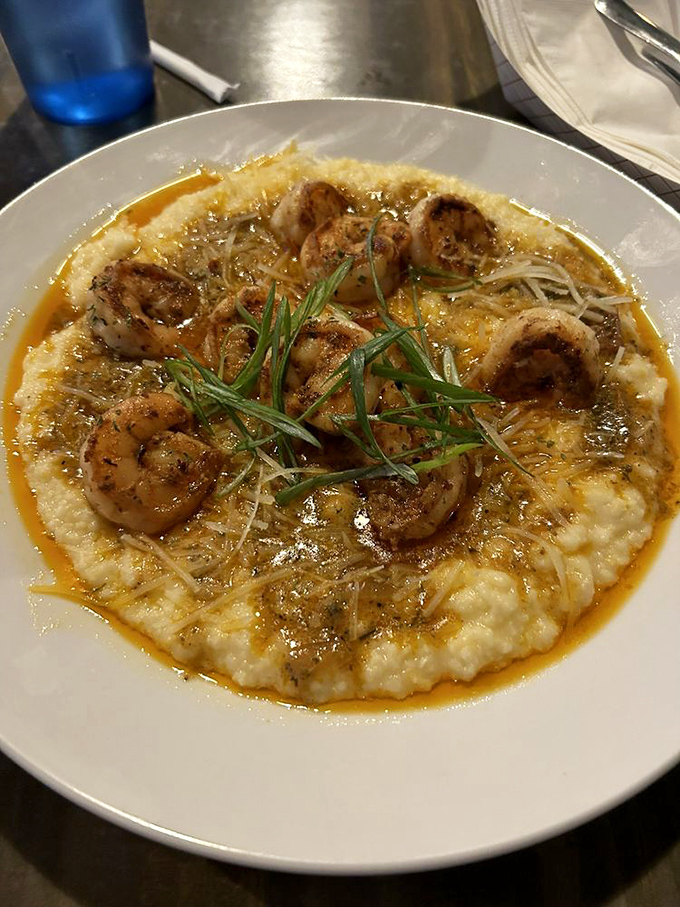 The shrimp and grits that launched a thousand road trips – plump shrimp nestled on creamy grits with a sauce worth bottling.
