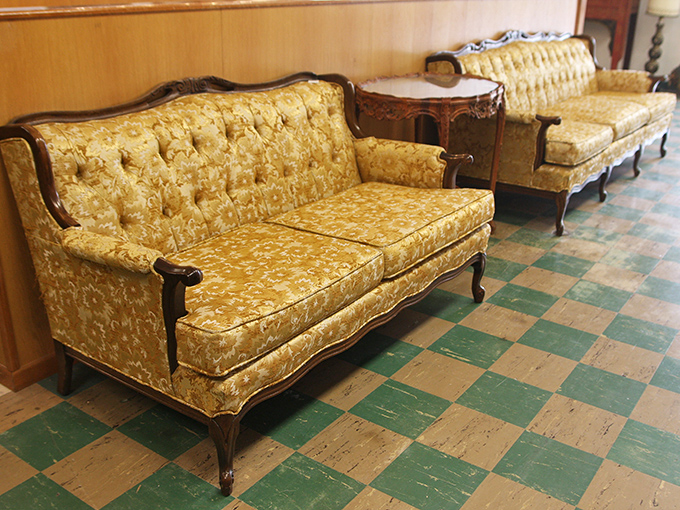 These golden vintage sofas aren't just furniture—they're time capsules from an era when living rooms were for actual living.