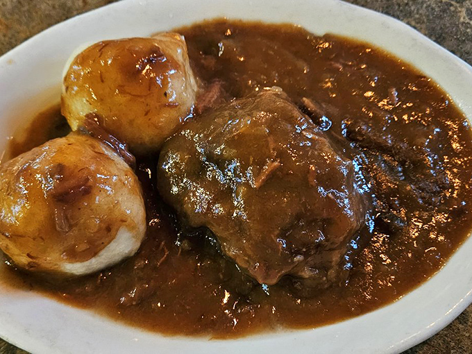 Sour beef and dumplings that would make your German grandmother weep with joy—tender meat swimming in a rich gravy alongside pillowy potato dumplings.