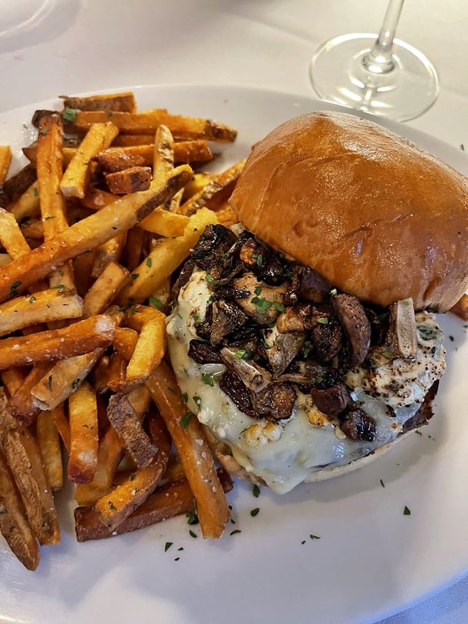 Not just another burger joint creation. This towering masterpiece with mushrooms and melty cheese demands both napkins and respect.