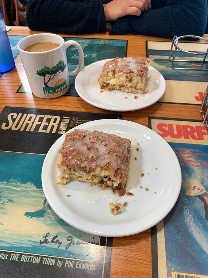 The legendary coffee cake that launches a thousand return visits—moist, cinnamon-swirled perfection that makes sharing a true test of friendship.