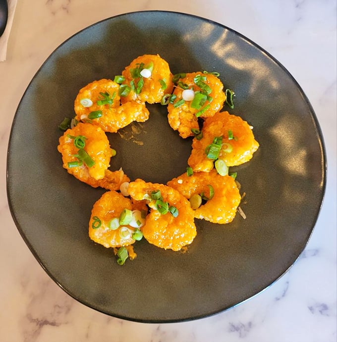 Golden tempura shrimp arranged like edible exclamation points – crispy, light, and gone before you know it.