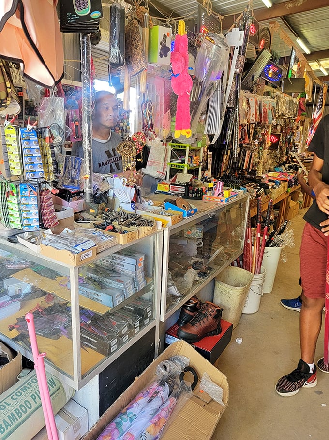 A vendor's stall overflows with colorful trinkets, tools, and treasures. Shopping here is like an archaeological dig where everything's for sale.