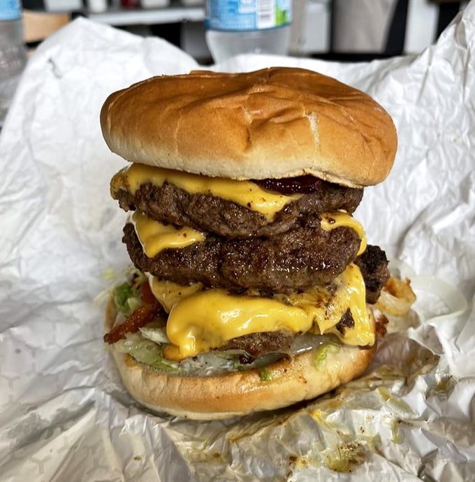 The triple-decker burger isn't so much a meal as it is a dare wrapped in cheese and sandwiched between buns. Your cardiologist won't approve, but your soul will.