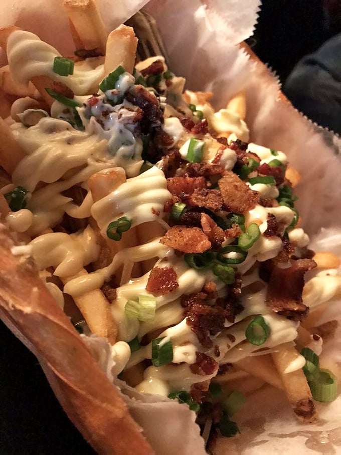 These aren't just fries—they're a bacon-topped, cheese-smothered declaration of independence from boring sides. Freedom never tasted so good.
