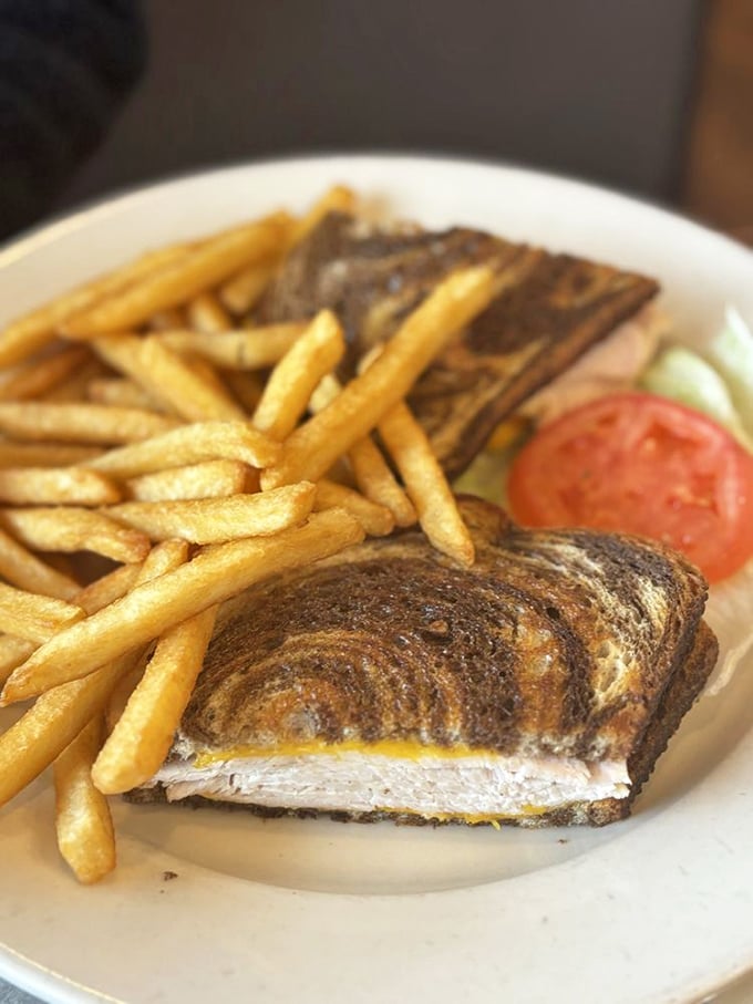 The humble tuna melt – elevated to art form. That perfect golden-brown exterior hides a creamy interior that puts fancy sandwiches to shame.