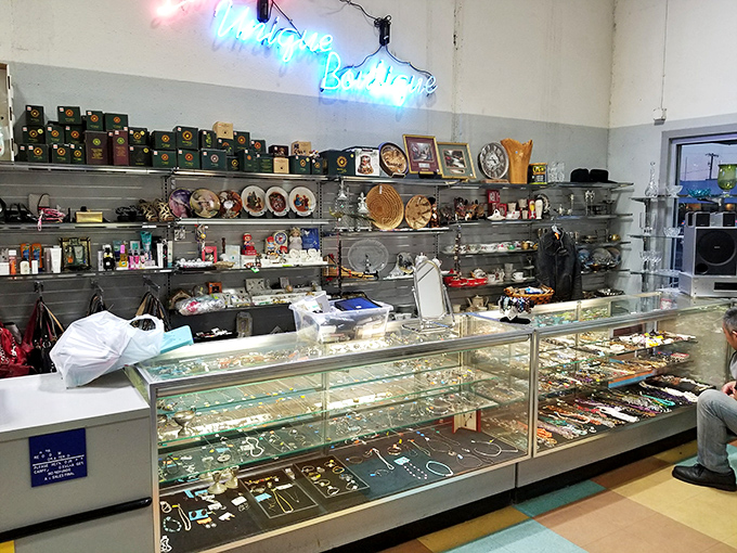 The jewelry counter gleams with possibility—one person's forgotten accessory is another's vintage statement piece.