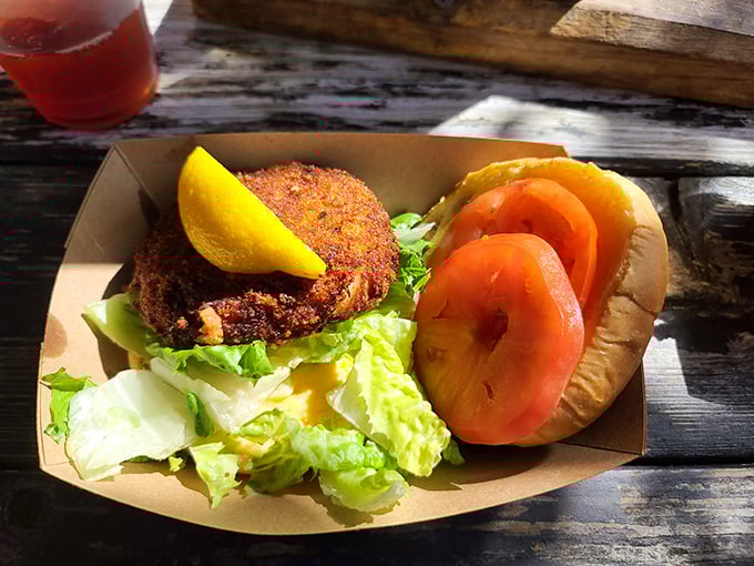 Even landlubbers find happiness here. This veggie burger with fresh tomato and crisp lettuce proves seafood shacks can please everyone in your crew.