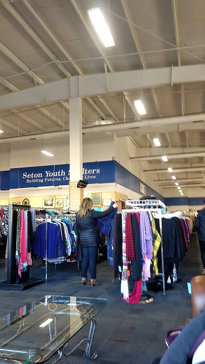 The art of thrifting in action – carefully examining each piece like a detective searching for clues to hidden value.