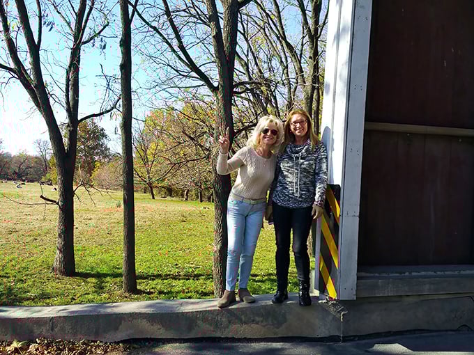 Making memories at the bridge entrance. Some travelers come from across the country just to stand where horse-drawn buggies still regularly pass.