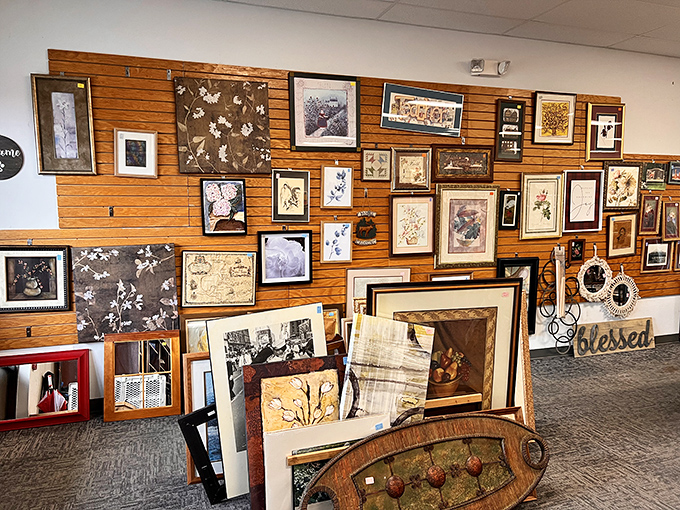 A wall of framed art that would make any blank space in your home feel personally attacked for its emptiness.