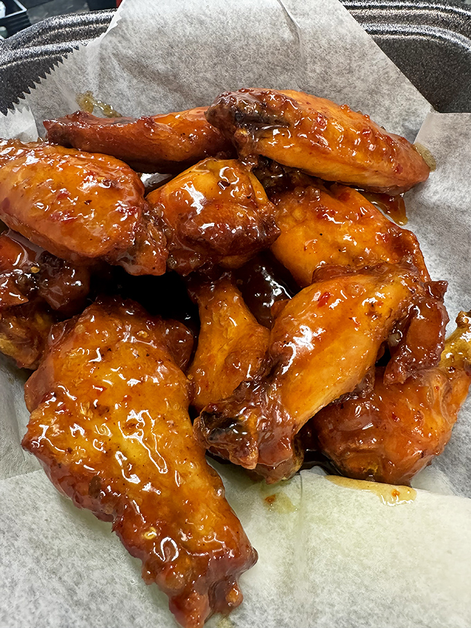 These wings aren't just glazed – they're having their moment in the spotlight, glistening like they just won a talent show.