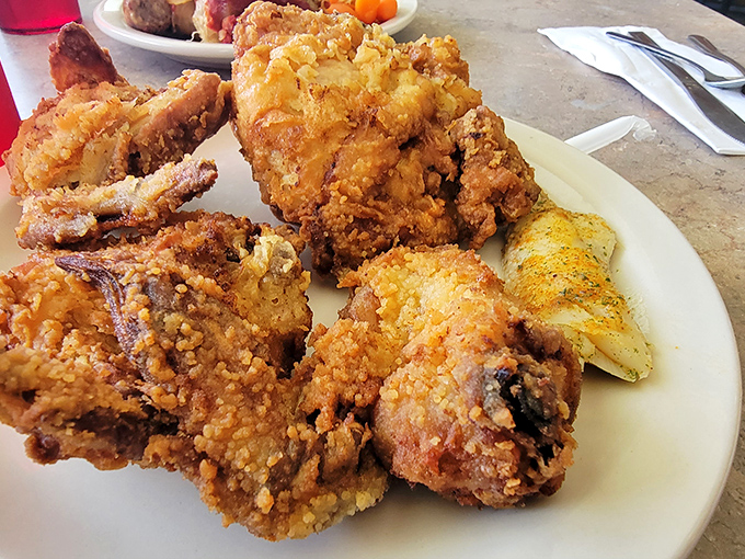 Golden-brown fried chicken that crackles with each bite – the kind that makes you wonder if they've somehow improved on the laws of physics.