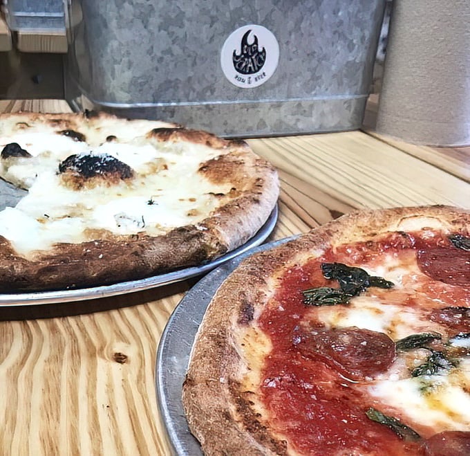 A study in contrasts: pillowy crust with perfect char marks alongside a white pie that would make an Italian grandmother weep with joy.