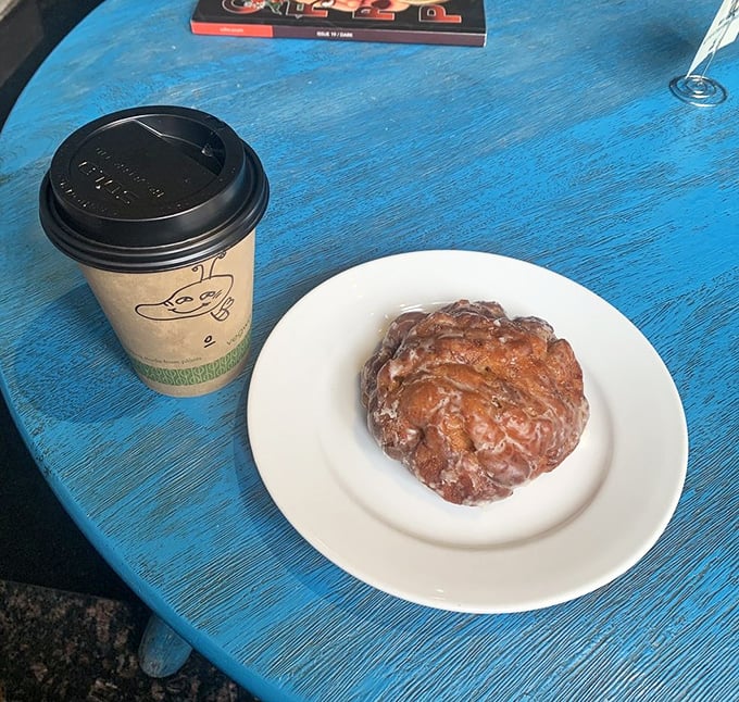 This apple fritter isn't just a pastry, it's a commitment—gloriously glazed, perfectly puffed, and waiting to be your breakfast wingman alongside that house coffee.