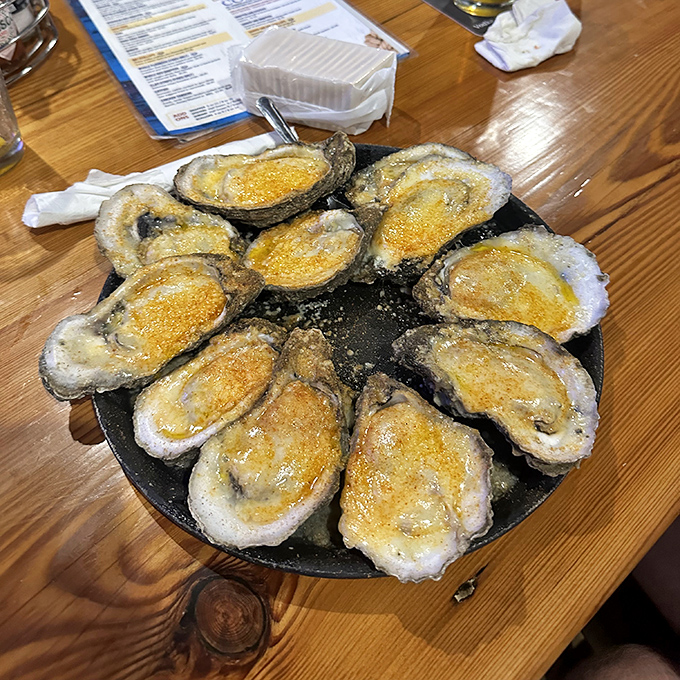 Baked oysters wearing their Sunday best—a cheesy, golden crown fit for seafood royalty. Resistance is futile, seconds are inevitable.