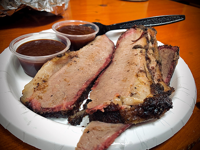 Brisket with that telltale pink smoke ring is barbecue's holy grail—tender enough to cut with a glance, yet substantial enough to satisfy.