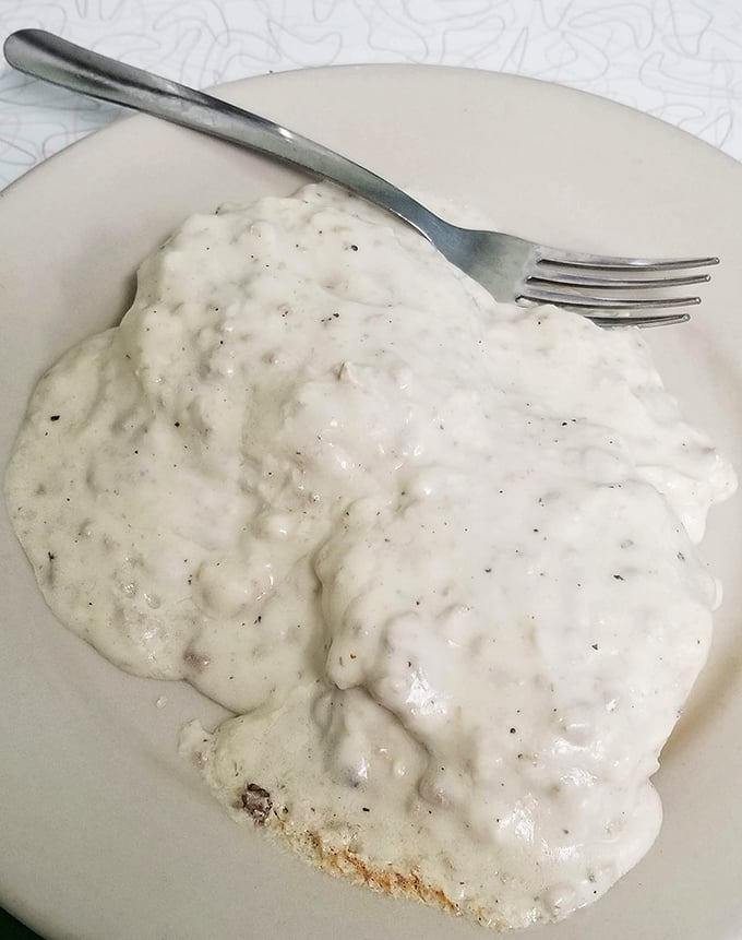 Biscuits and gravy that would make your grandmother both proud and jealous – a creamy, peppery blanket of comfort covering a golden foundation.