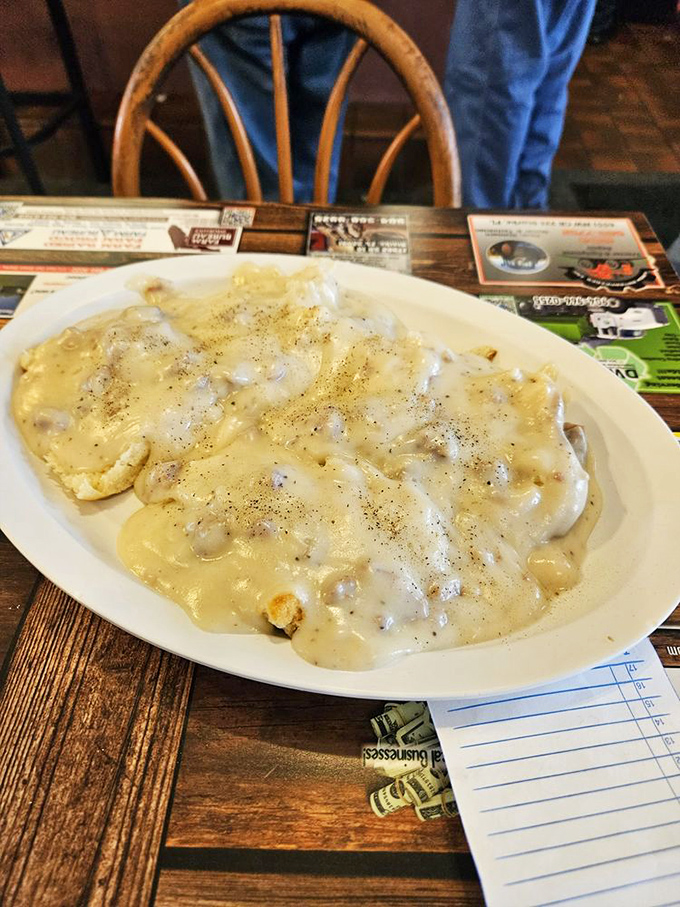 Biscuits and gravy that would make your Southern grandmother weep with joy—a creamy, peppery blanket covering tender islands of dough.