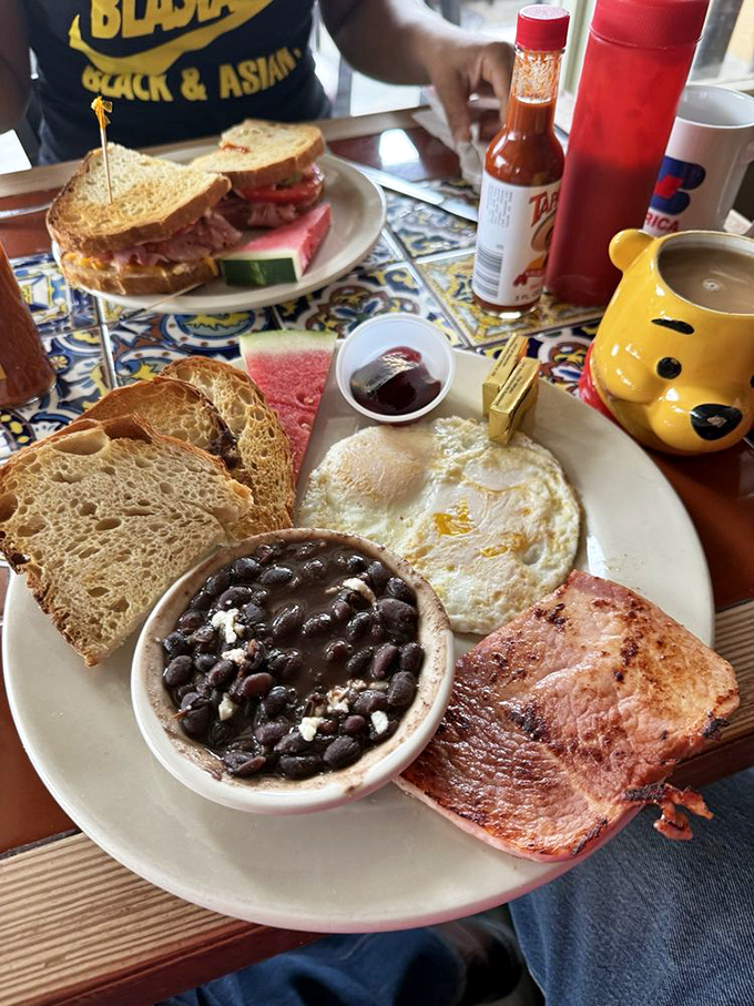 When black beans meet perfectly cooked eggs, breakfast becomes a symphony of satisfying Southern comfort.