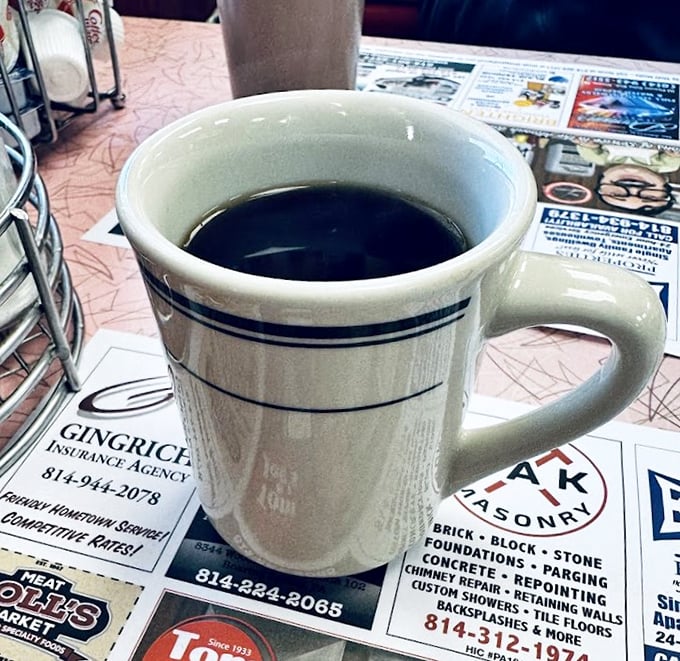 The humble diner mug—civilization's most honest drinking vessel. No pretentious handles, no artisanal glazing, just endless coffee and local gossip.