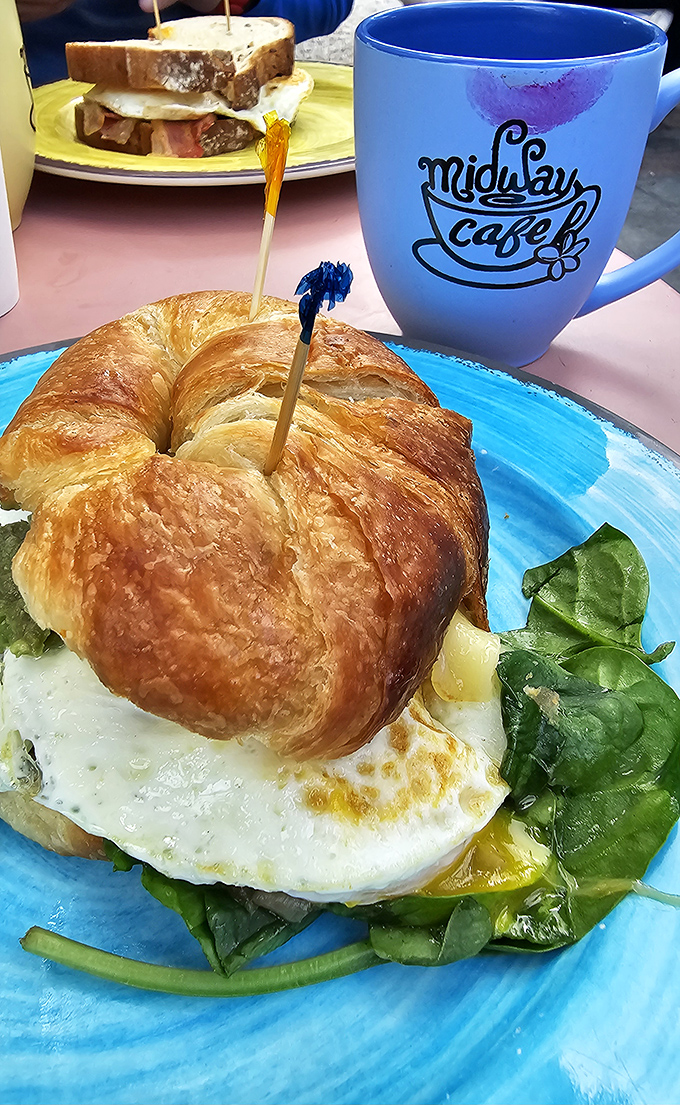 The perfect breakfast sandwich doesn't exi— Oh wait, here it is! Golden croissant, perfectly cooked egg, and that signature blue mug standing guard.