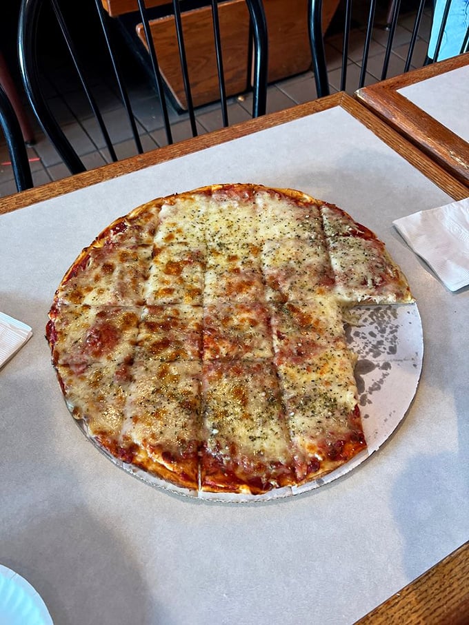 Pizza perfection in its simplest form. That cheese pull would make any food photographer weep with joy—and any hungry patron reach for a slice.