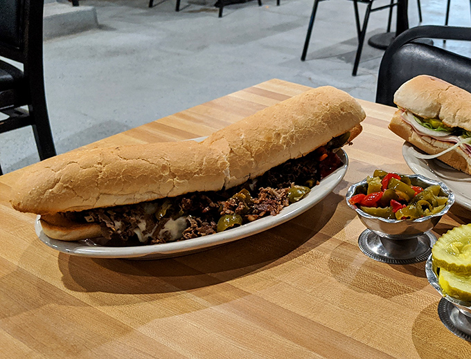 Not all heroes wear capes—some come on fresh Italian bread. This cheesesteak is the kind of sandwich that requires both hands and zero shame.