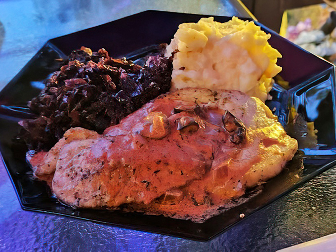 Red cabbage that pops like a Warhol painting next to pork that's more tender than a love letter. This plate doesn't just feed you—it hugs you.