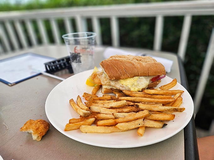 Sometimes paradise comes on a bun – a hearty sandwich and golden fries enjoyed with that priceless Gulf Coast breeze.