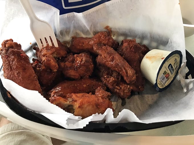 Wings that would make Buffalo jealous, served in a basket that says "forget the fancy, focus on flavor."