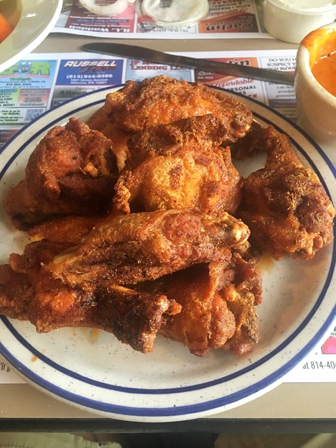 These golden-fried chicken wings aren't just cooked, they're transformed – crispy, seasoned perfection that demands to be devoured immediately.