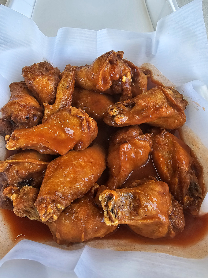 These wings aren't just cooked, they're transformed. Glistening with sauce that promises to recalibrate your understanding of chicken perfection.