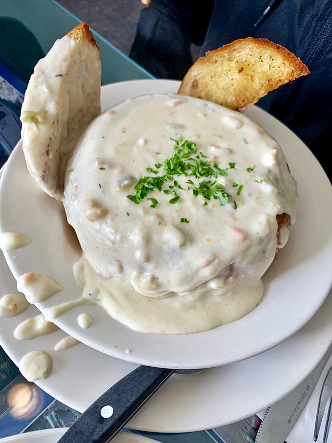 This isn't just clam chowder; it's a creamy bowl of coastal comfort that makes foggy days worthwhile. Toasted bread: perfect dipping vehicle.