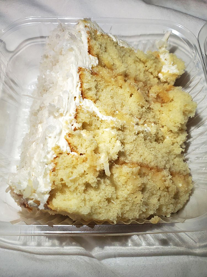 The famous coconut cake in its natural habitat—moist, tender, and ready to make you forget every other cake you've ever met.