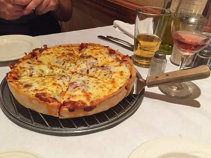 This deep dish isn't just a pizza—it's an architectural marvel of dough, cheese, and sauce that demands both respect and an empty stomach.