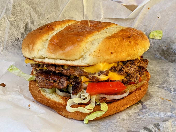 Not all heroes wear capes; some come with melted cheese cascading down double beef patties. This cheeseburger might require a strategic attack plan and extra napkins.
