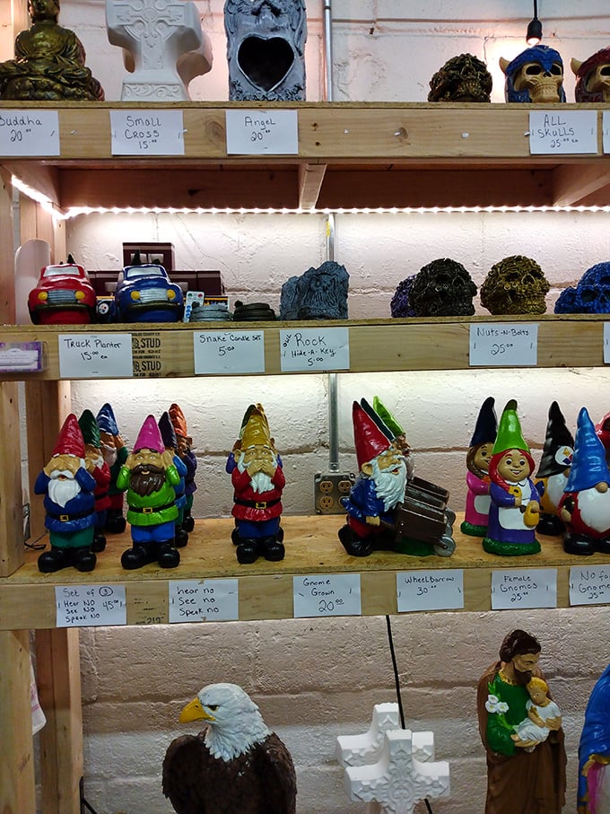 Garden gnomes stand at attention alongside Buddha statues and eagles—a quirky United Nations of lawn ornaments waiting for their forever homes.