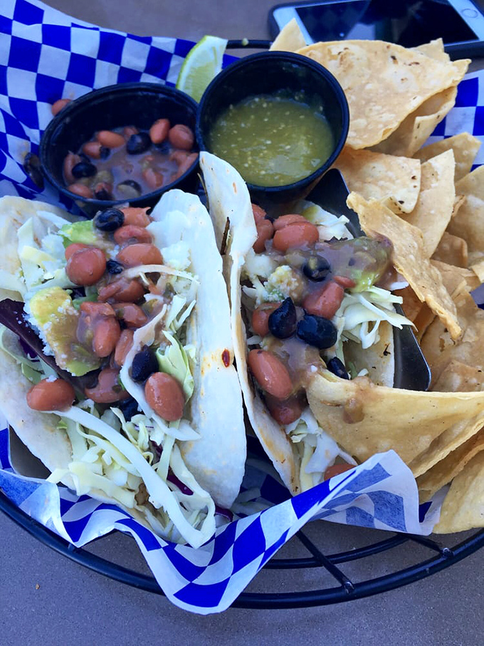 Fish tacos that make you question all other tacos you've ever known—topped with beans and cabbage and served with a side of harbor views.