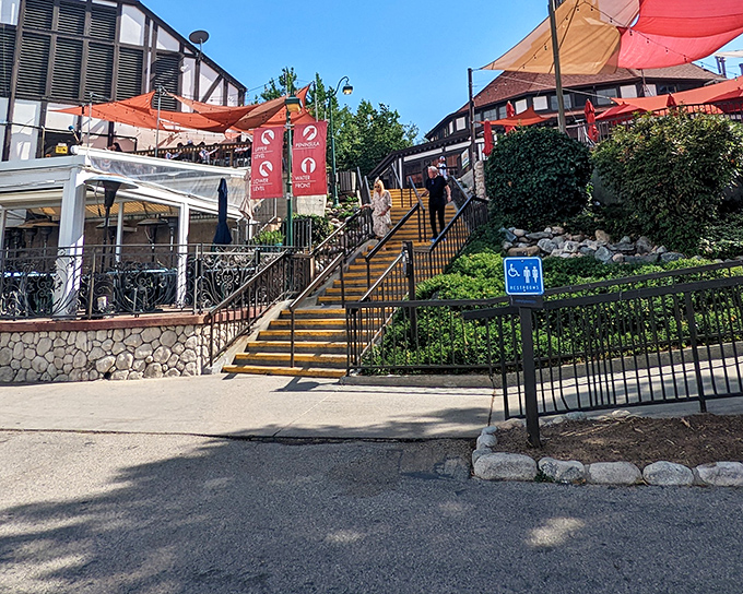 The Village's terraced restaurants offer more than meals—they're staging areas for people-watching and the occasional "I shouldn't have ordered that third beer" stair challenge.